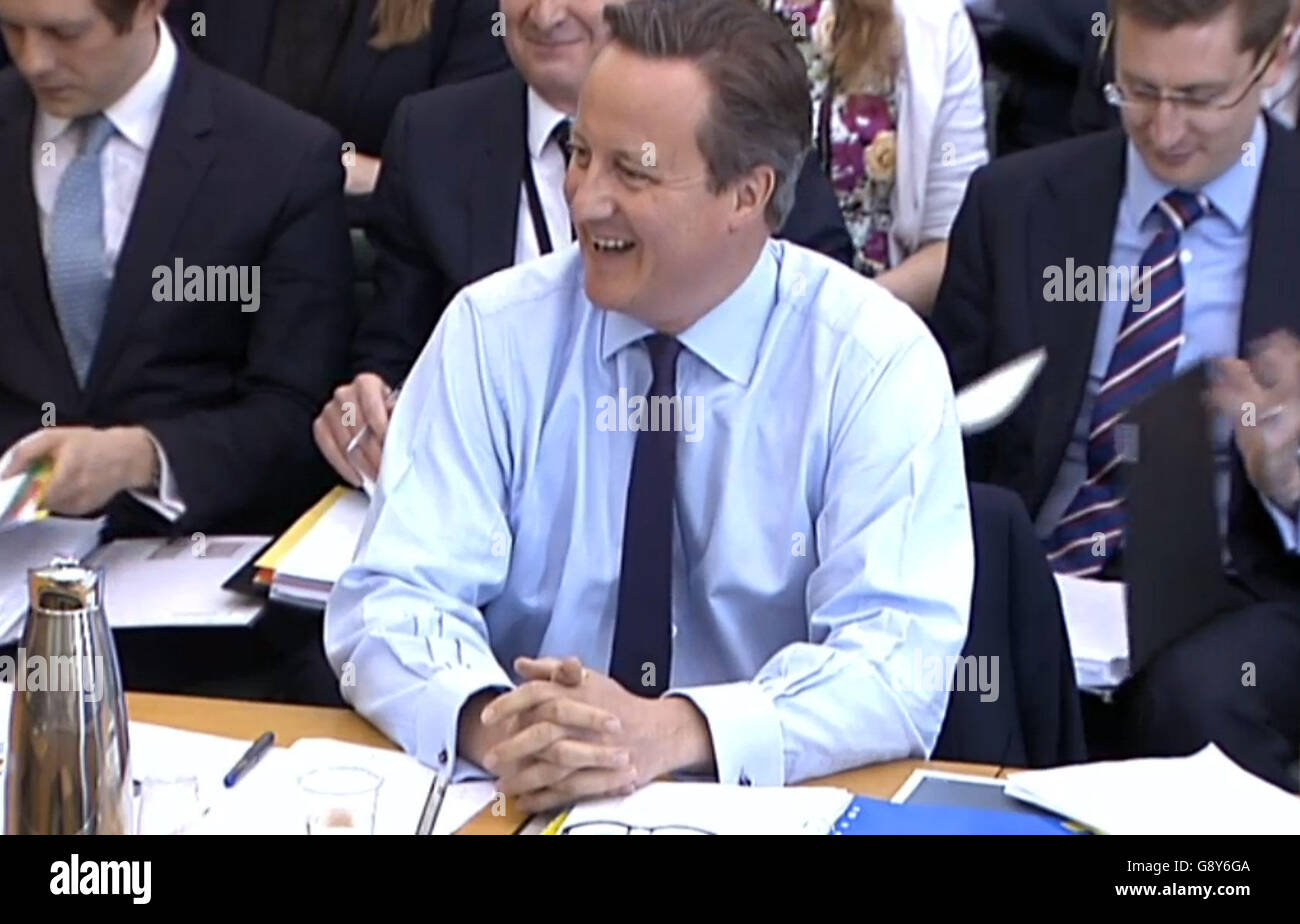 Prime Minister David Cameron laughs as he is welcomed before giving ...