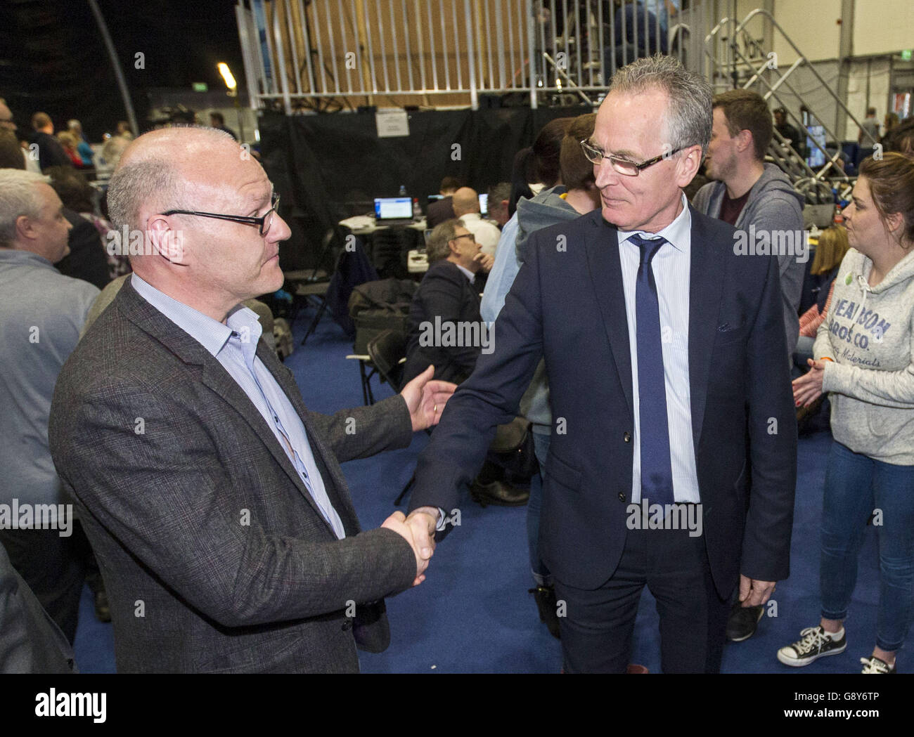 Paul Maskey of Sinn Fein congratulates fellow party member Gerry Kelly ...