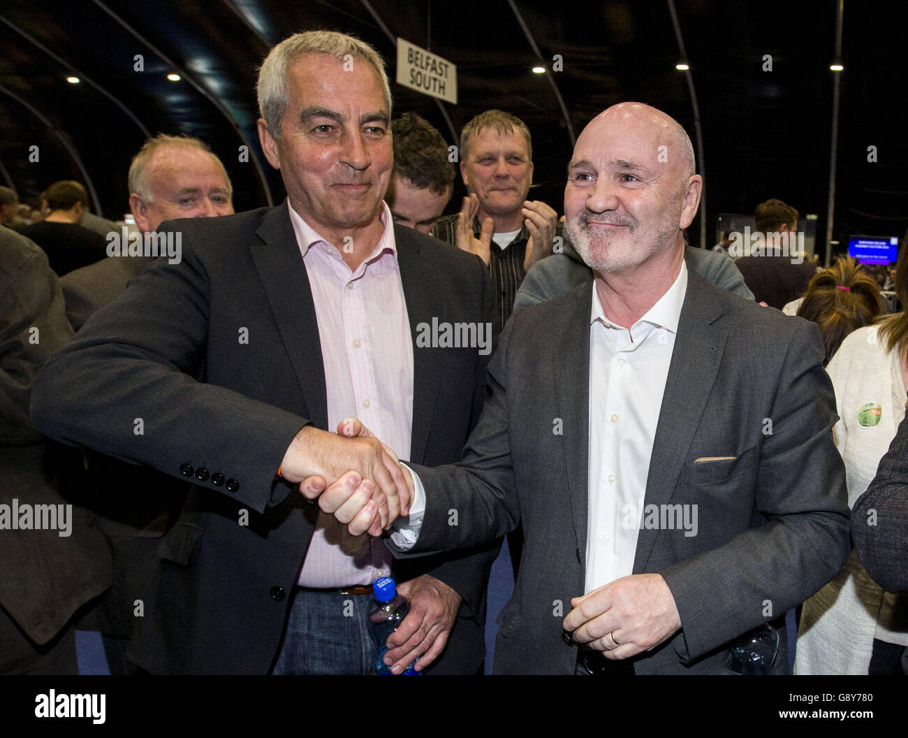 Alex Maskey (right) of Sinn Fein is congratulated by fellow candidate ...