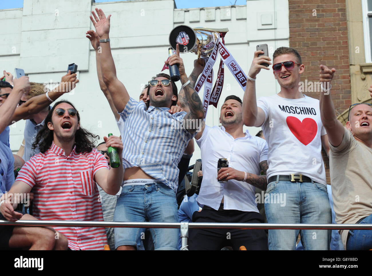 Northampton players during the open top bus parade in Northampton Stock ...