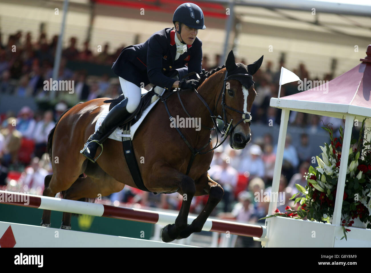 Kristina Cook riding Star Witness competes in the show jumping phase of ...