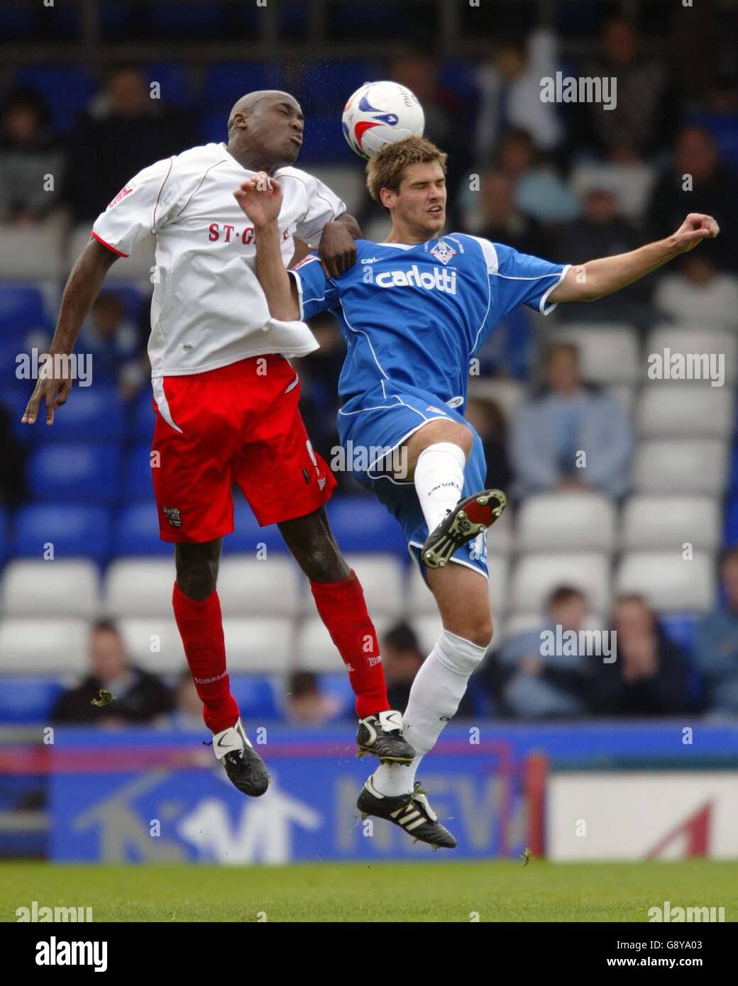 Oldham Athletic's Danny Hall and Brentford's Lloyd Owusu battle for the ...