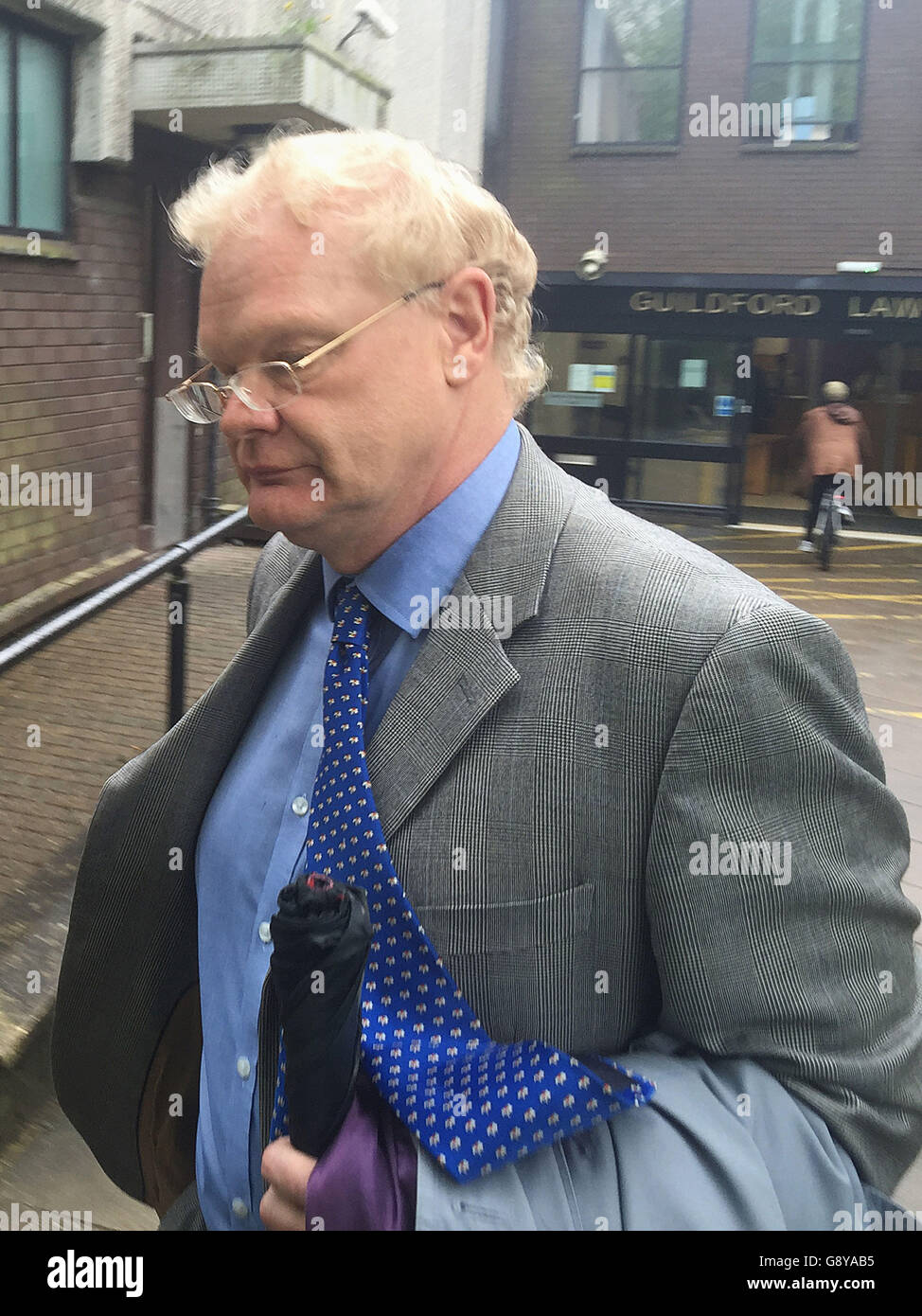 Dr Neil Ineson arrives at Guildford Magistrates' Court where he is ...