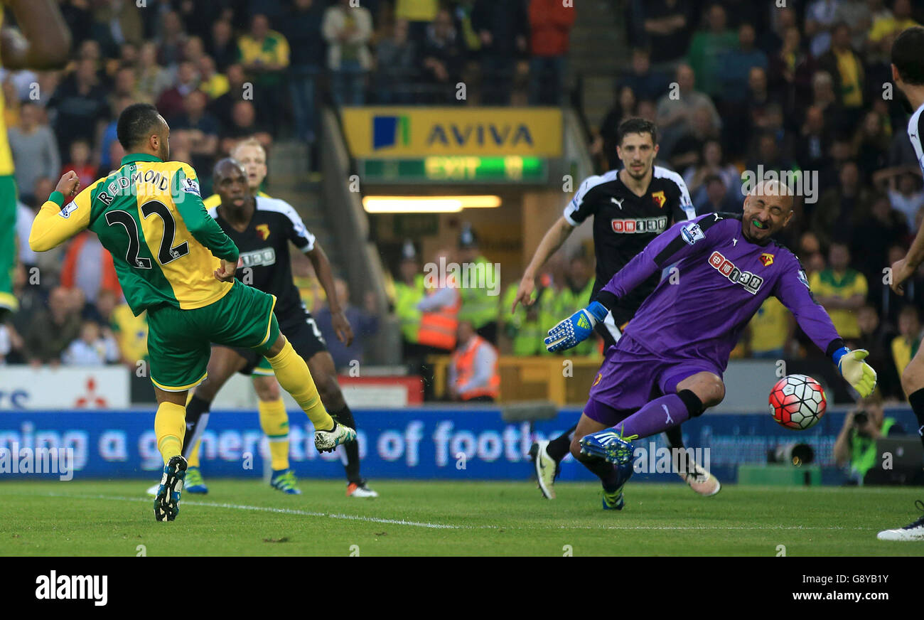 Norwich City's Nathan Redmond (left) sees an effort saved by Watford ...