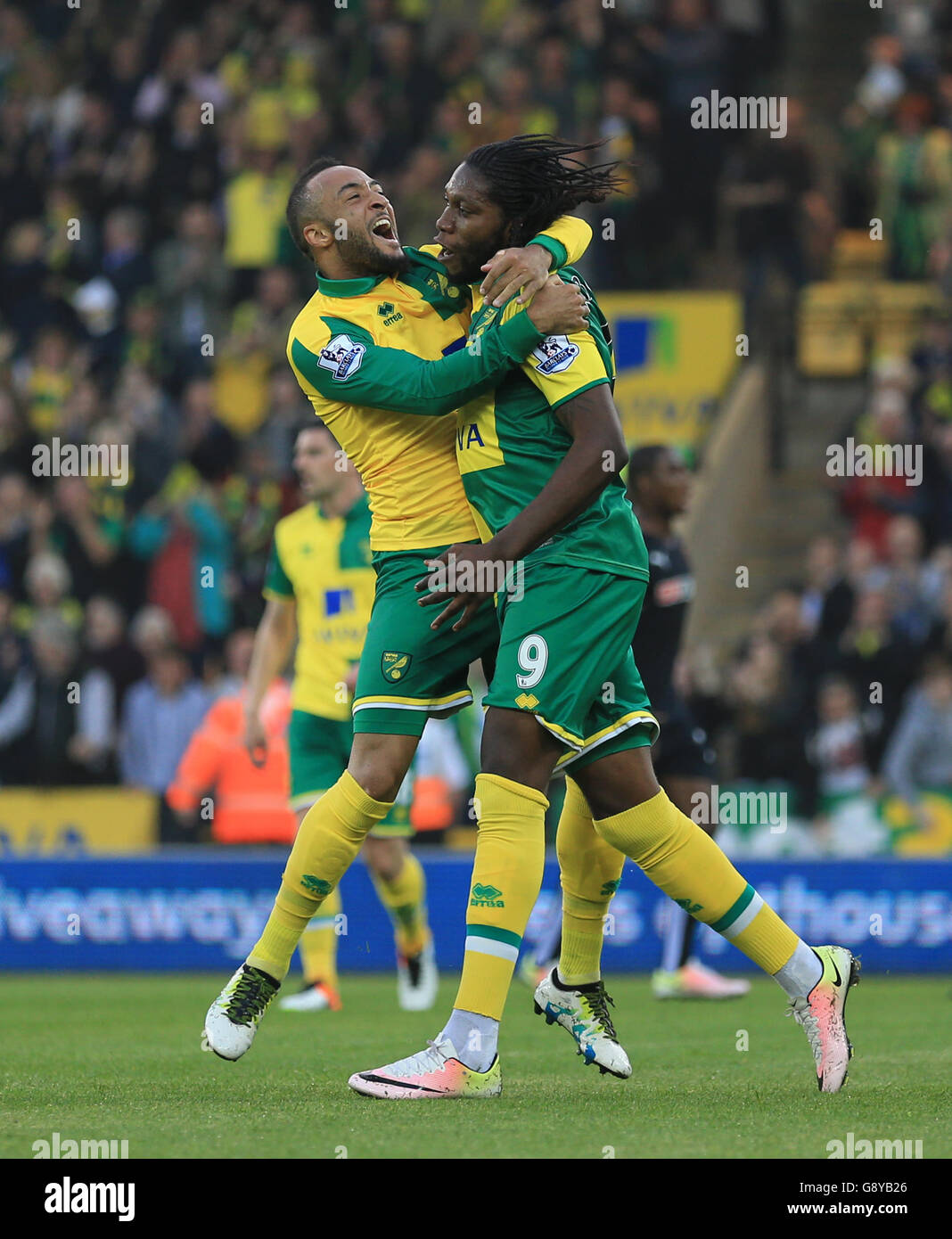 Norwich City's Dieumerci Mbokani (right) celebrates with Nathan Redmond ...