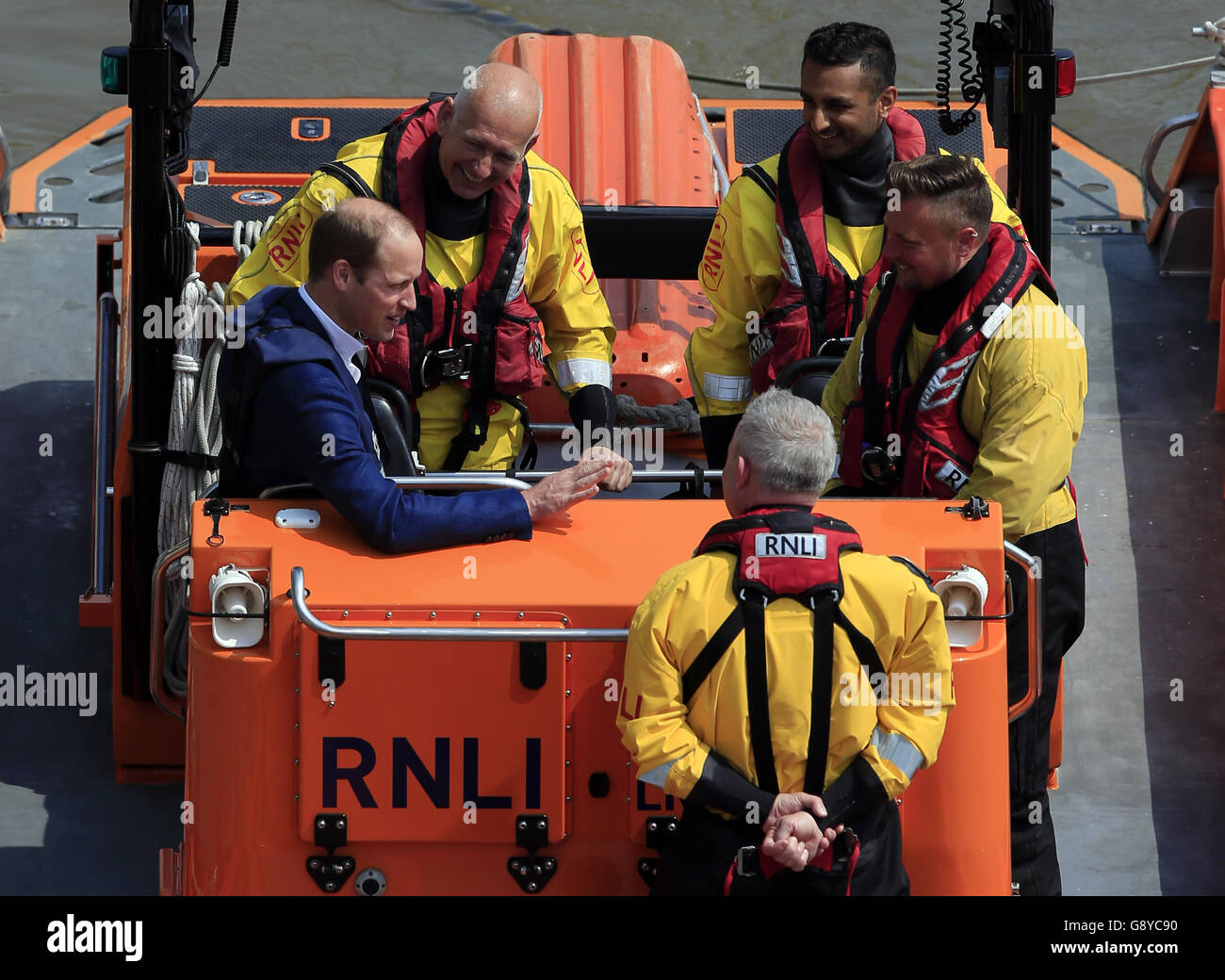 The Duke of Cambridge (left) speaks to RNLI crew on board a RIB at the ...