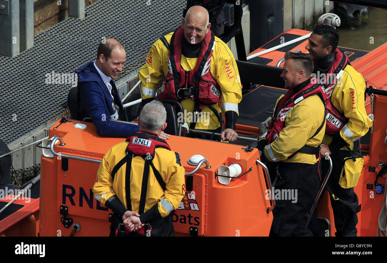 The Duke of Cambridge (left) speaks to RNLI crew on board a RIB at the ...