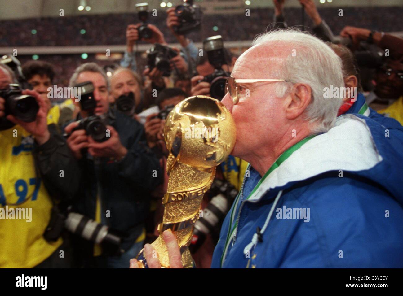 Brazil coach mario zagallo kisses the fifa confederations cup trophy hi ...