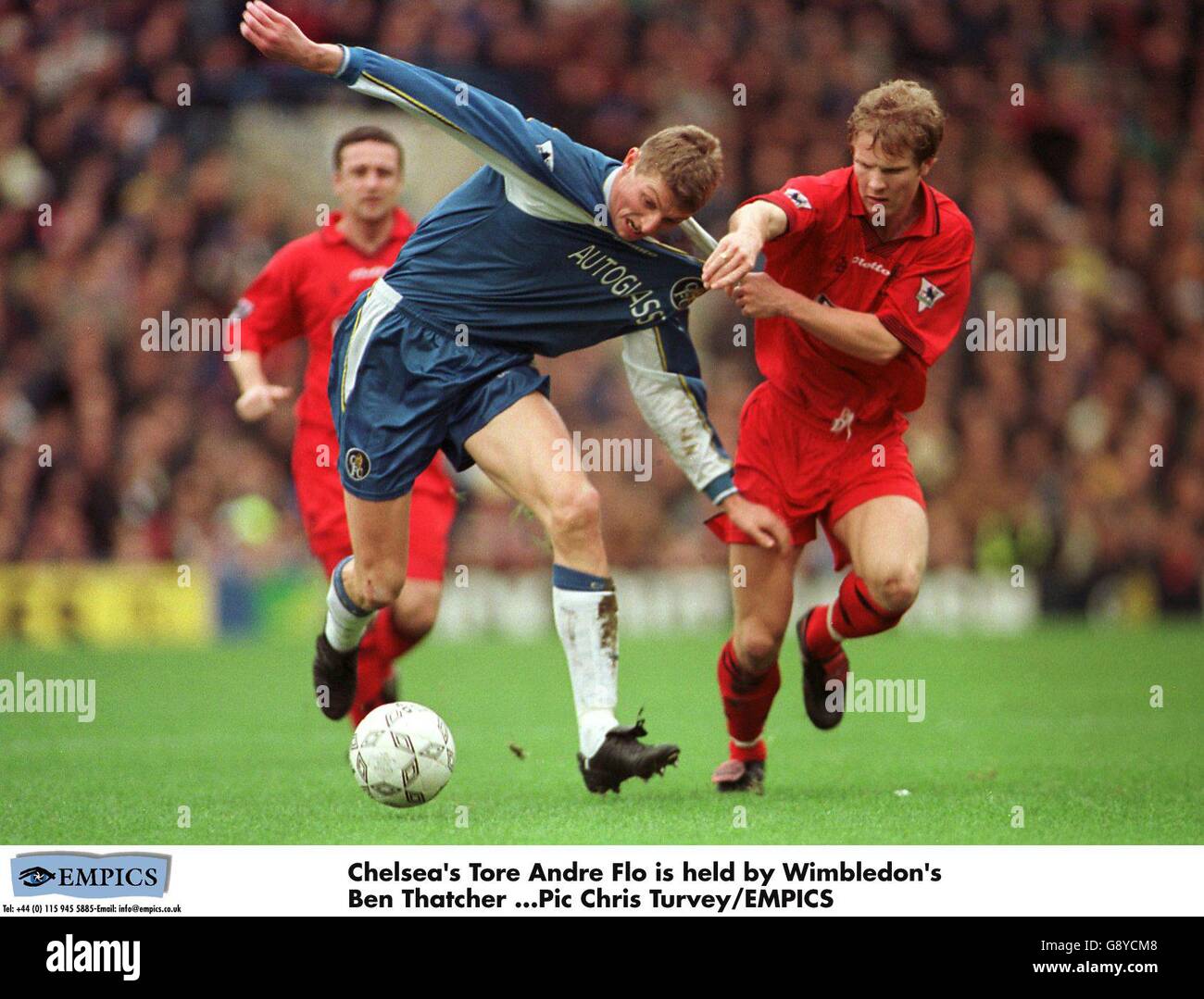 Two action full front view red blue foul football hi-res stock ...