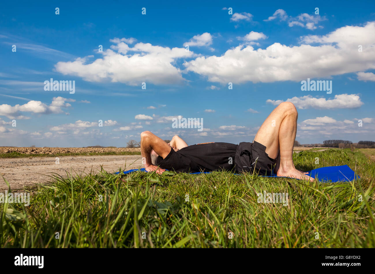 Man in wheel pose yoga hi-res stock photography and images - Alamy