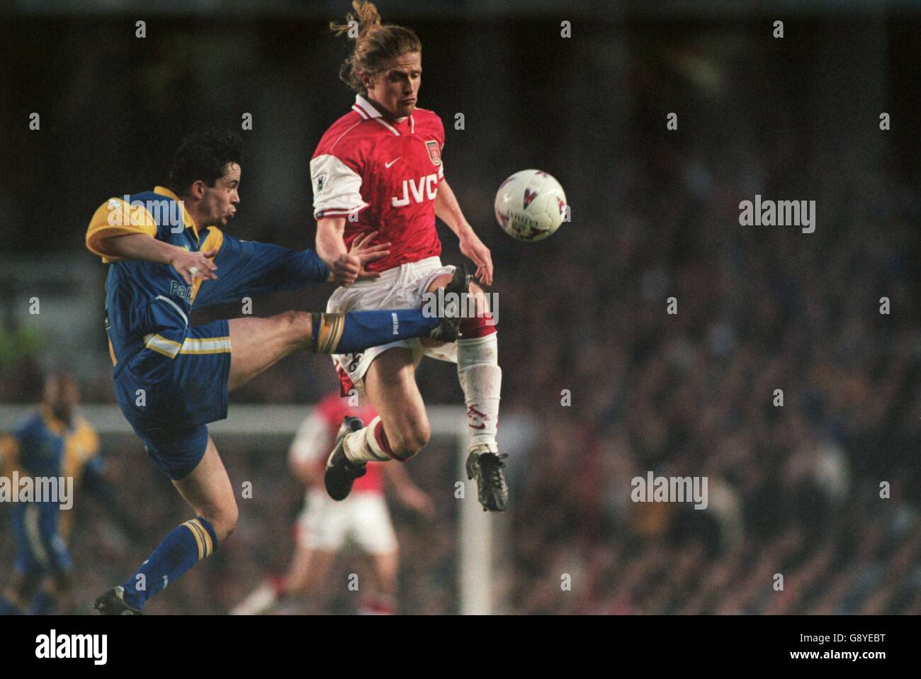 Leeds uniteds gary kelly left tackles arsenals emmanuel petit right hi ...