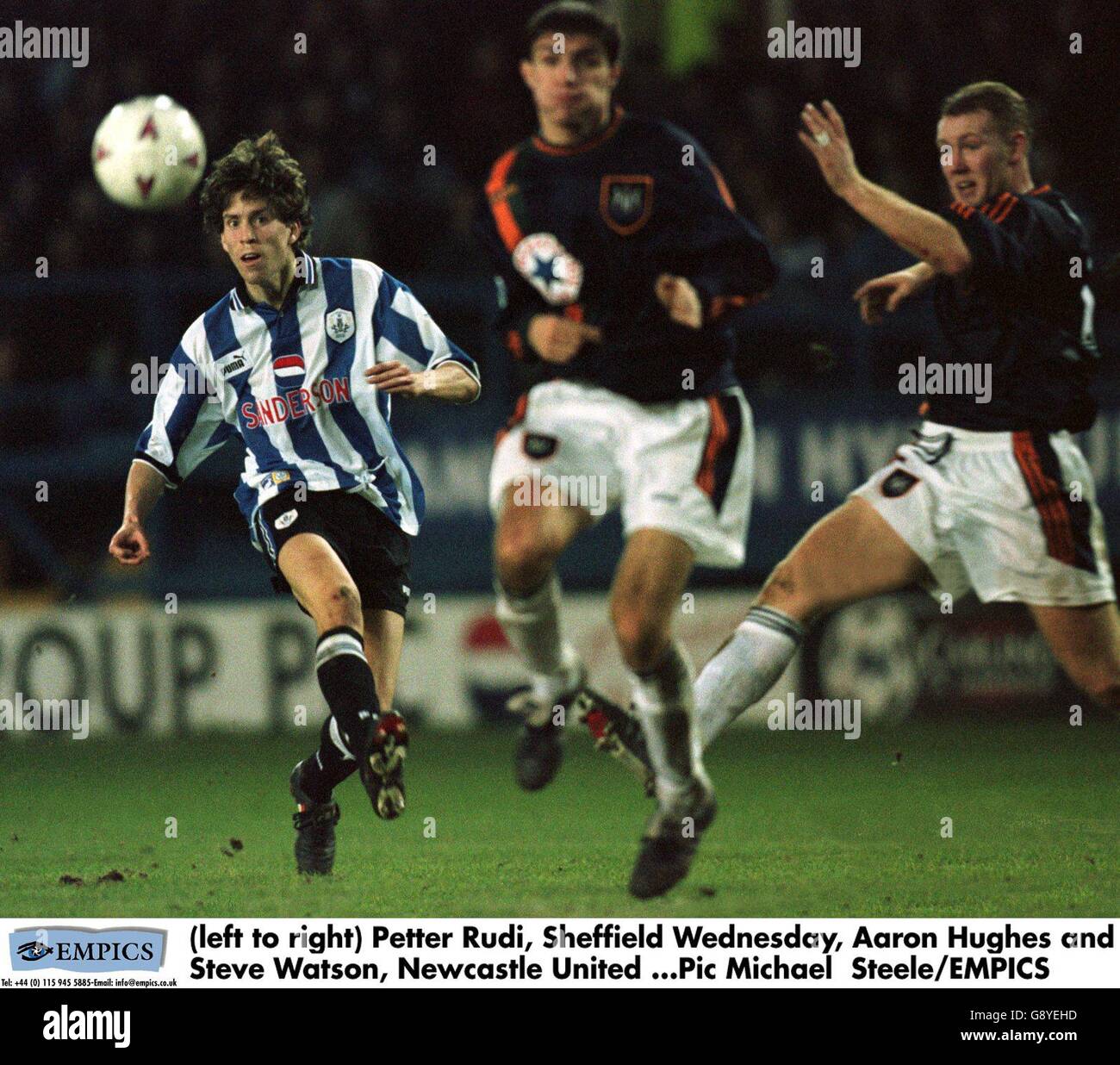 Petter Rudi of Sheffield Wednesday (left) chips the ball beyond Aaron ...