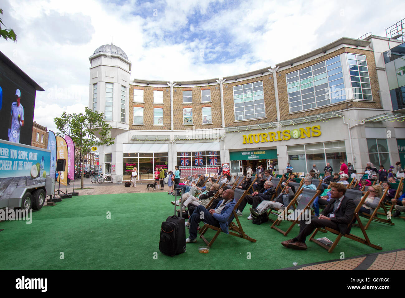 Wimbledon London,UK. 30th June 2016. Tennis enthusiasts sitting on ...