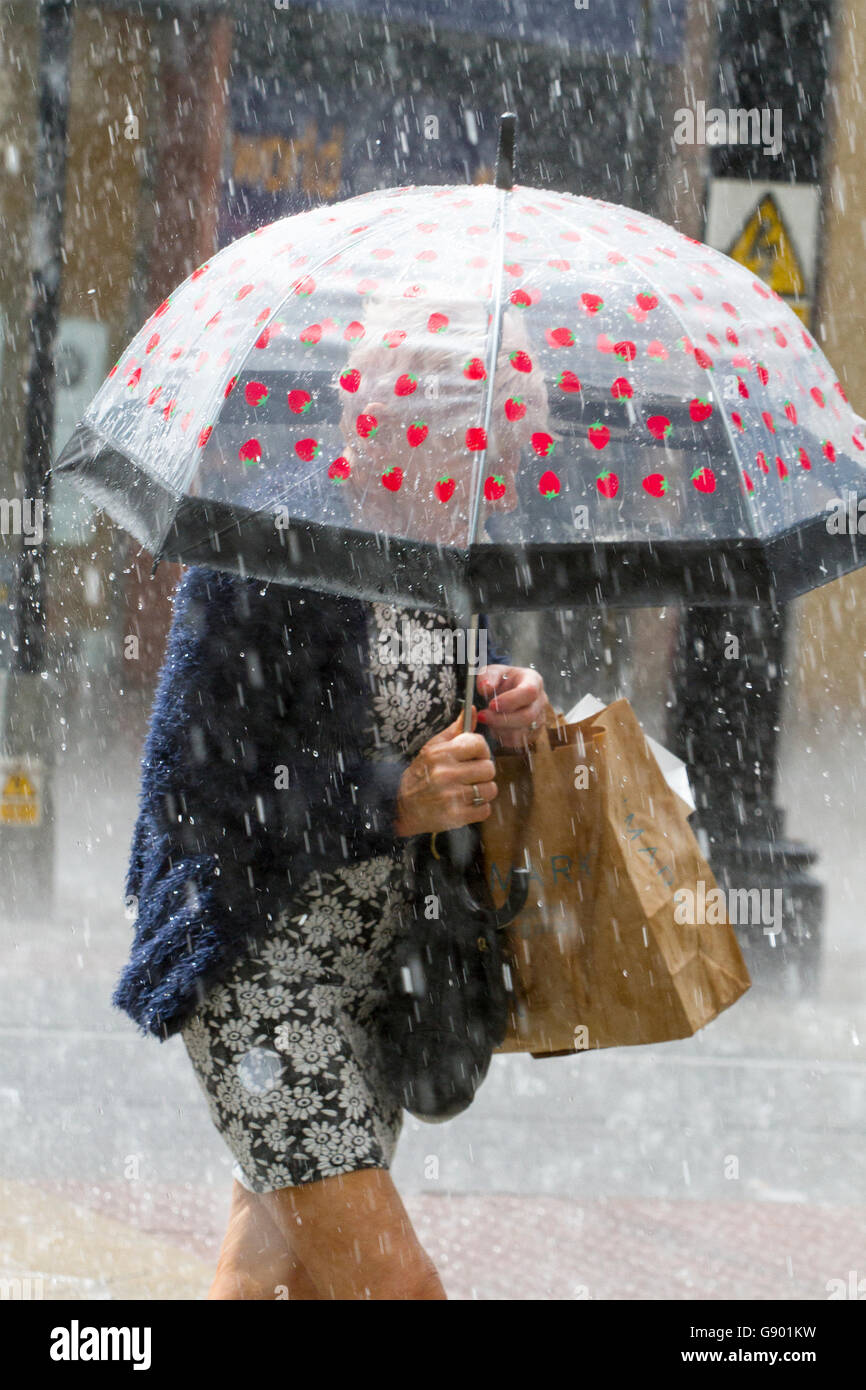 Pedestrian walking through rain england hi-res stock photography and ...