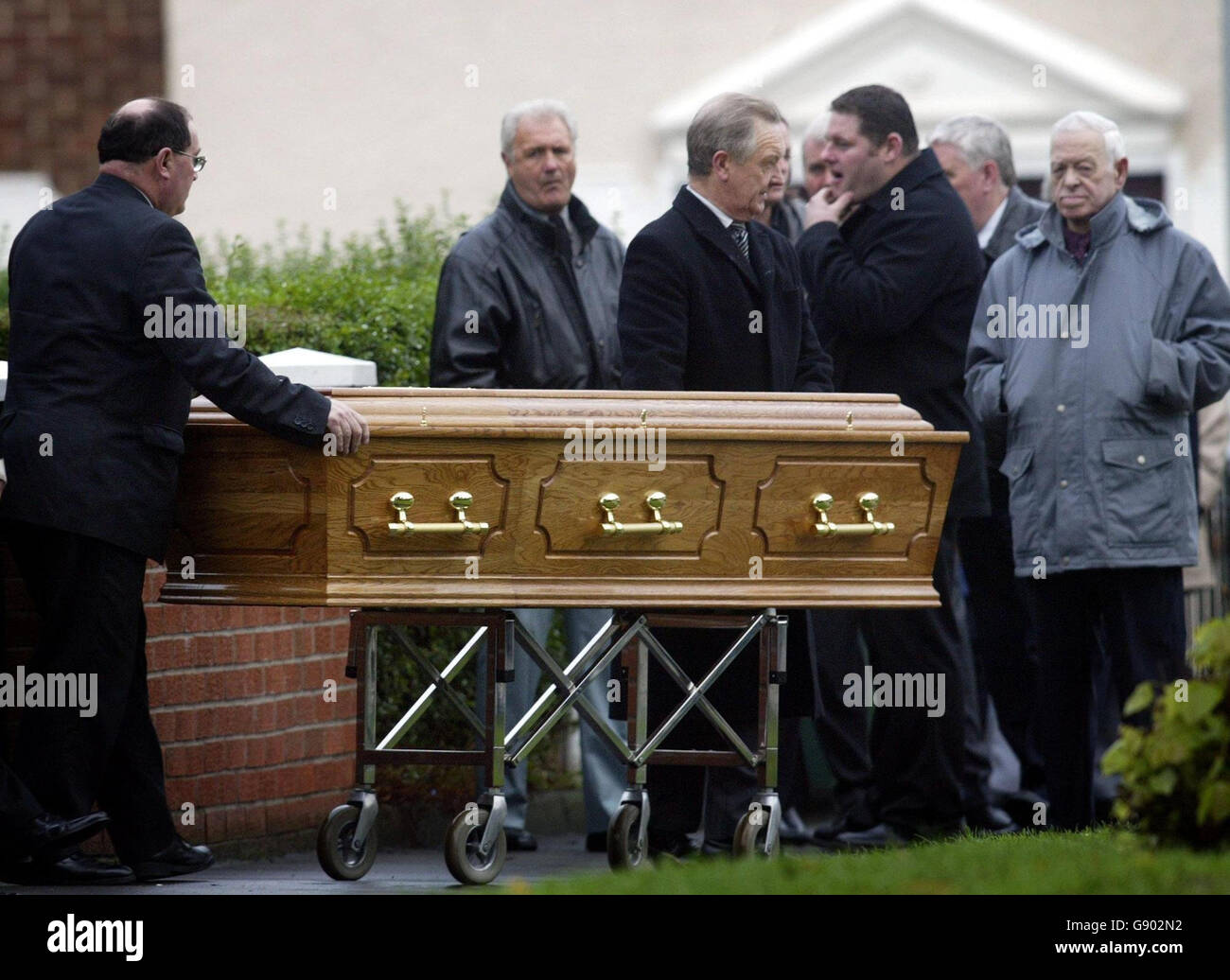 The coffin of former loyalist leader Jim Gray is removed from his ...