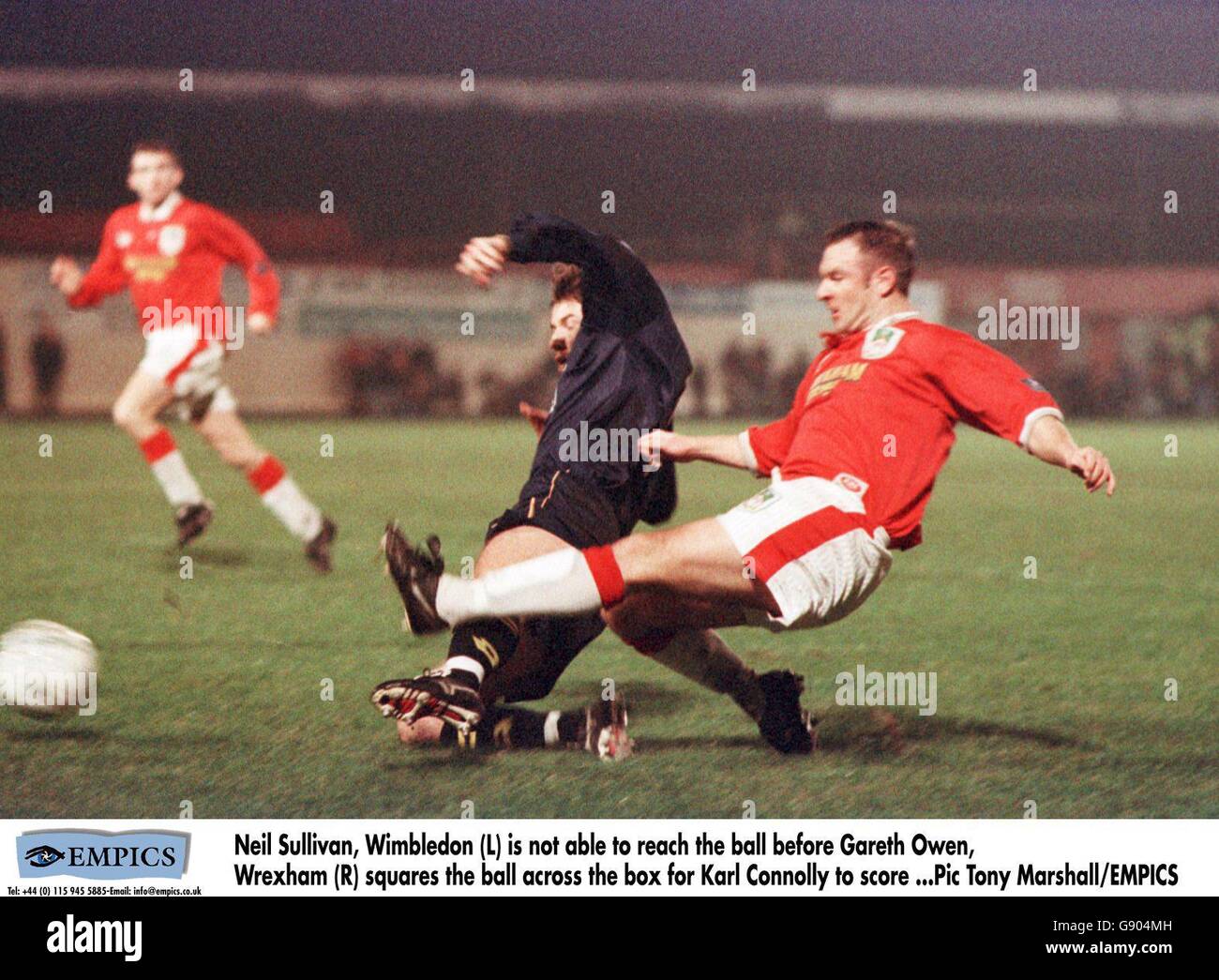 Gareth Owen of Wrexham (right) squares the ball across the box for Karl ...