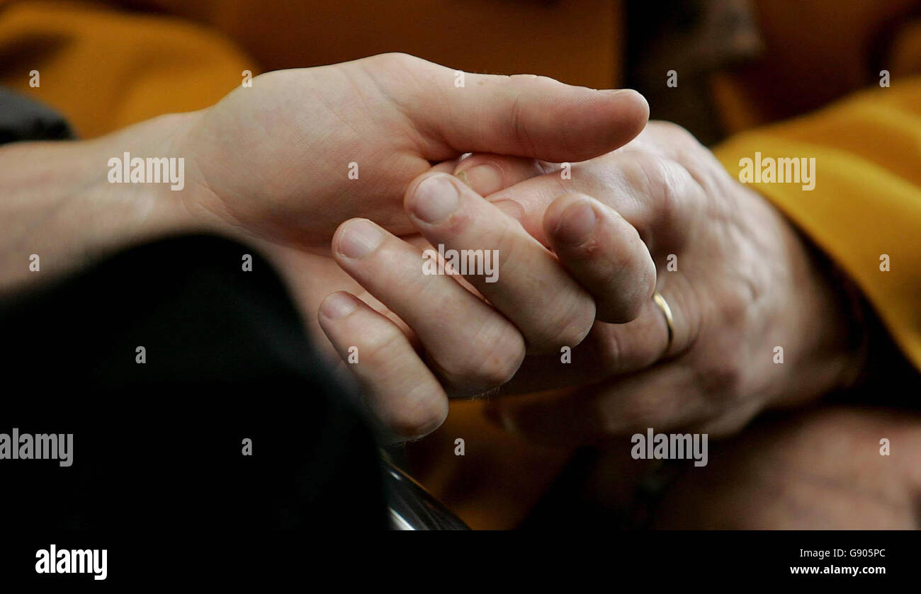 Rory Carroll holds his mother Kathy's hand at Dublin Airport, Sunday ...