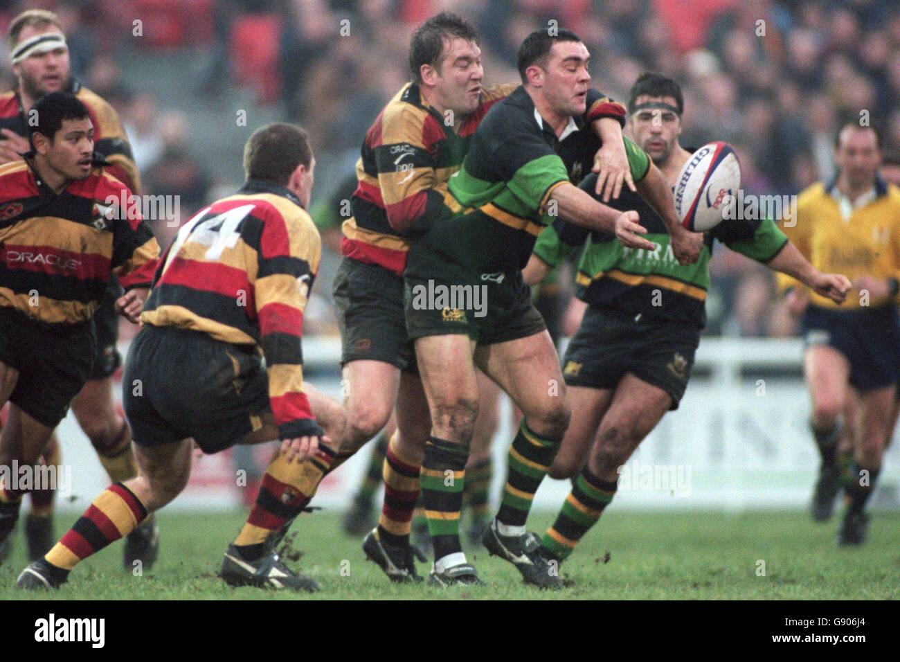 Richmond's Allan Bateman (left) and Jason Wright (centre) go to takle ...