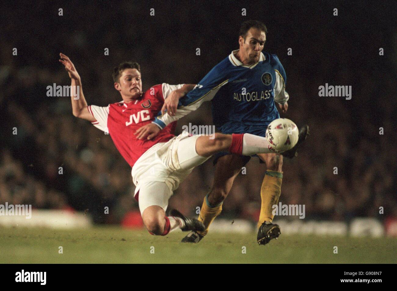 Arsenal's Stephen Hughes(L) tackles Chelsea's Laurent Charvet(R Stock ...