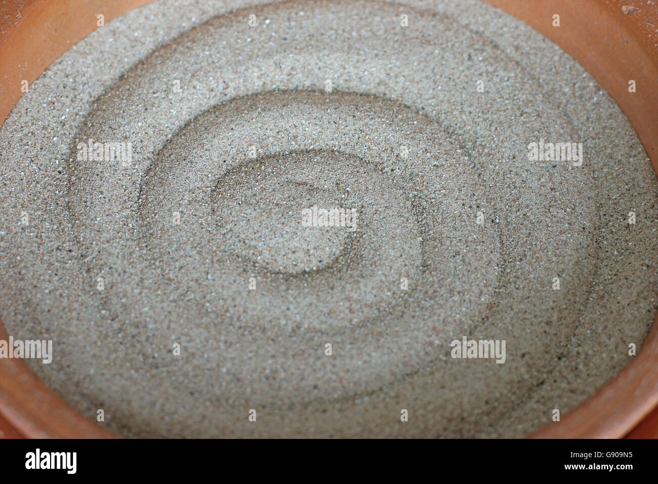 a empty sand ashtray with circle pattern Stock Photo - Alamy