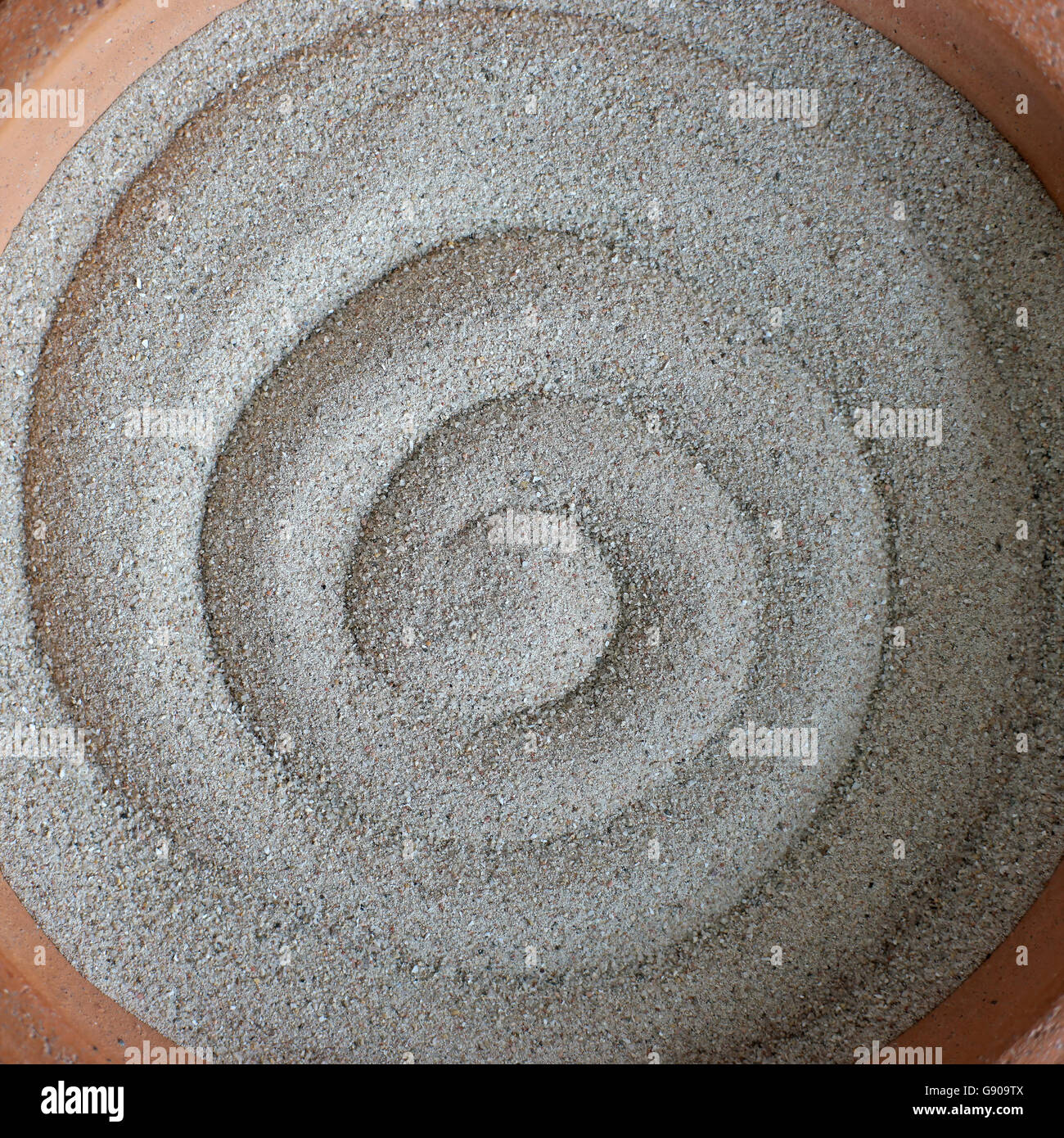 a empty sand ashtray with circle pattern Stock Photo - Alamy