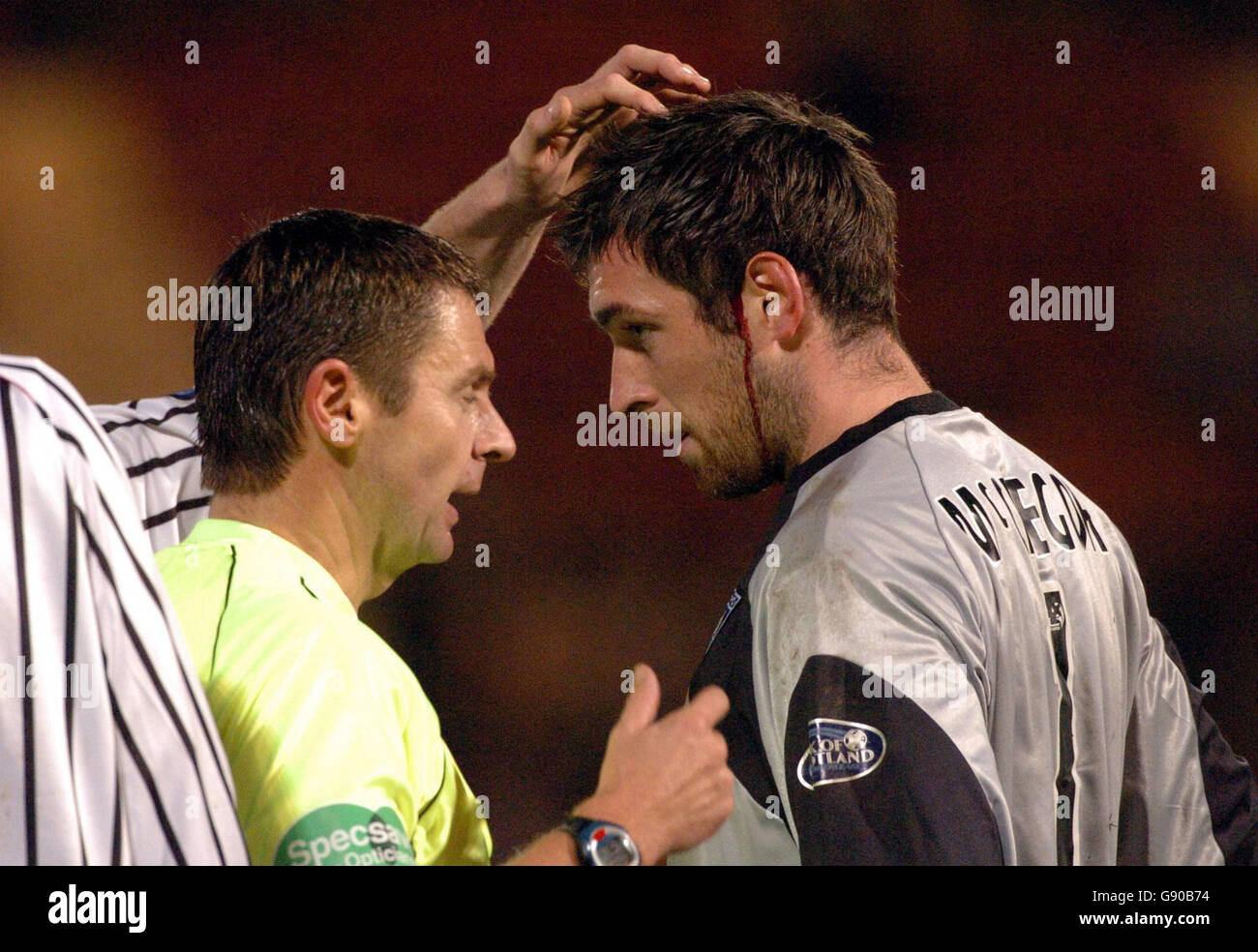 Referee Stuart Dougal checks out Dunfermline goalkeeper Allan McGregor ...