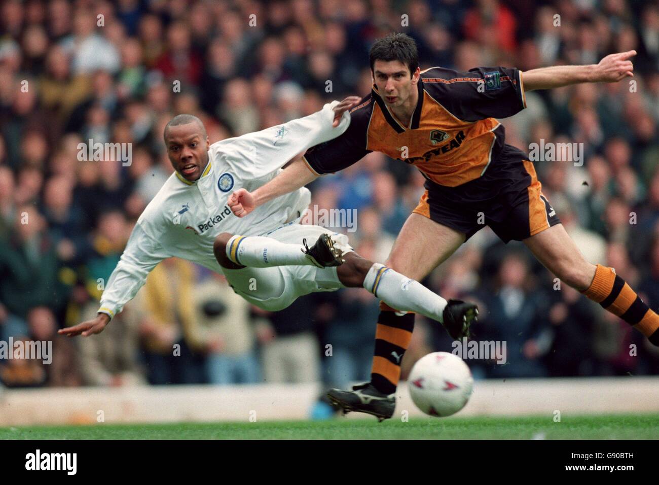 Rod Wallace, Leeds United (L) is sent flying under the challenge of ...