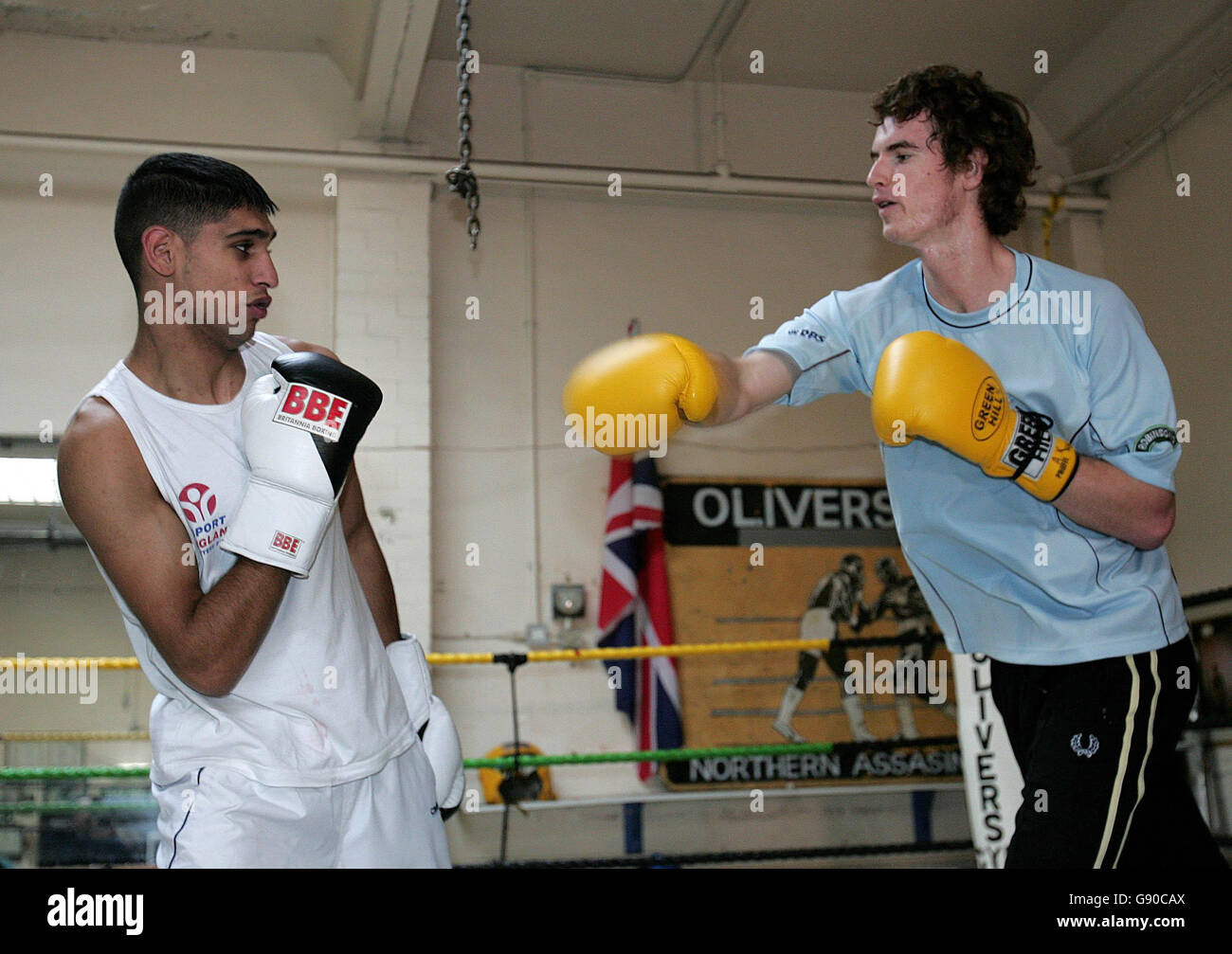 Olympic boxer Amir Khan (L) spars with tennis star Andrew Murray during ...