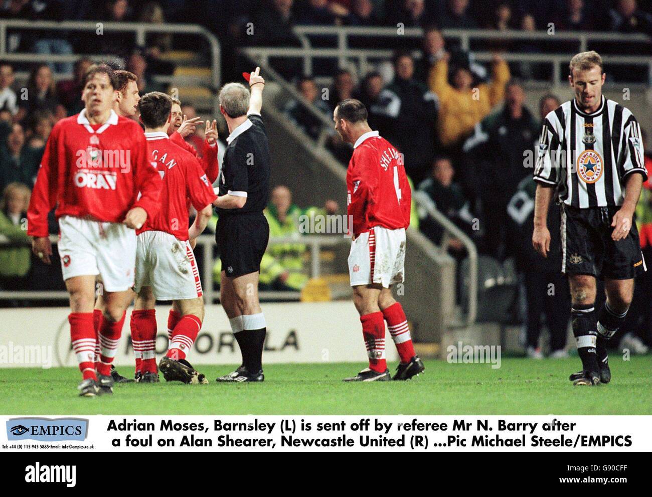 Adrian Moses of Barnsley (left) is sent off by referee Neale Barry ...