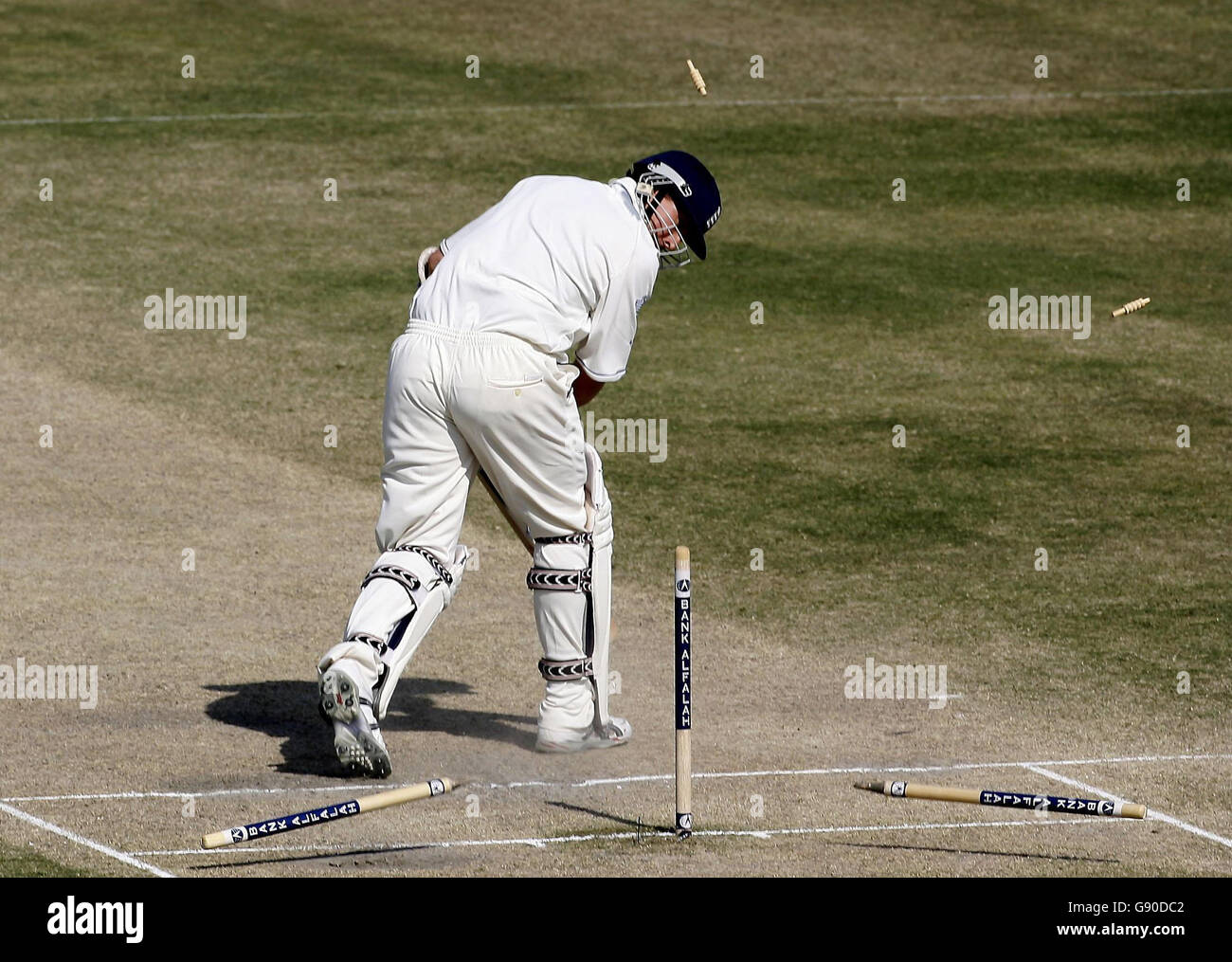 England's Ashley Giles looks down as he is clean bowled by Pakistan's ...