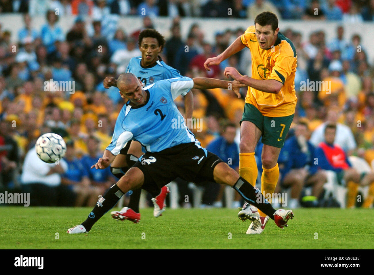 Uruguay's Guillermo Rodriguez (l) and Australia's Brett Emerton battle ...