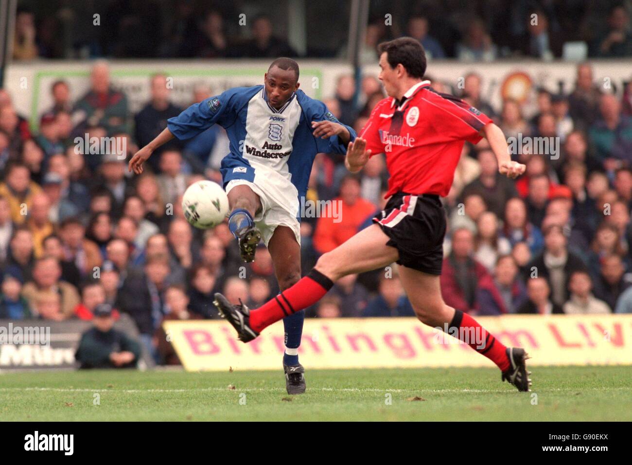 Nottingham Forest's Steve Chettle (right) is unable to block a shot ...
