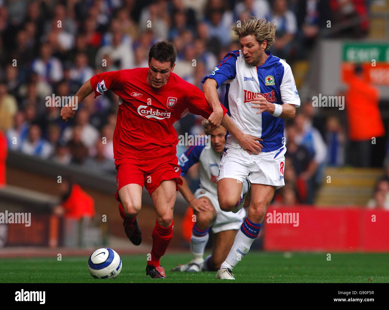 Liverpool's Steve Finnan and Blackburn Rovers' Robbie Savage battle for ...