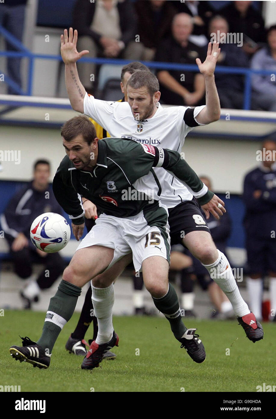 Luton Town's Kevin Nicholls (R) challenges Plymouth Argyle's Paul ...