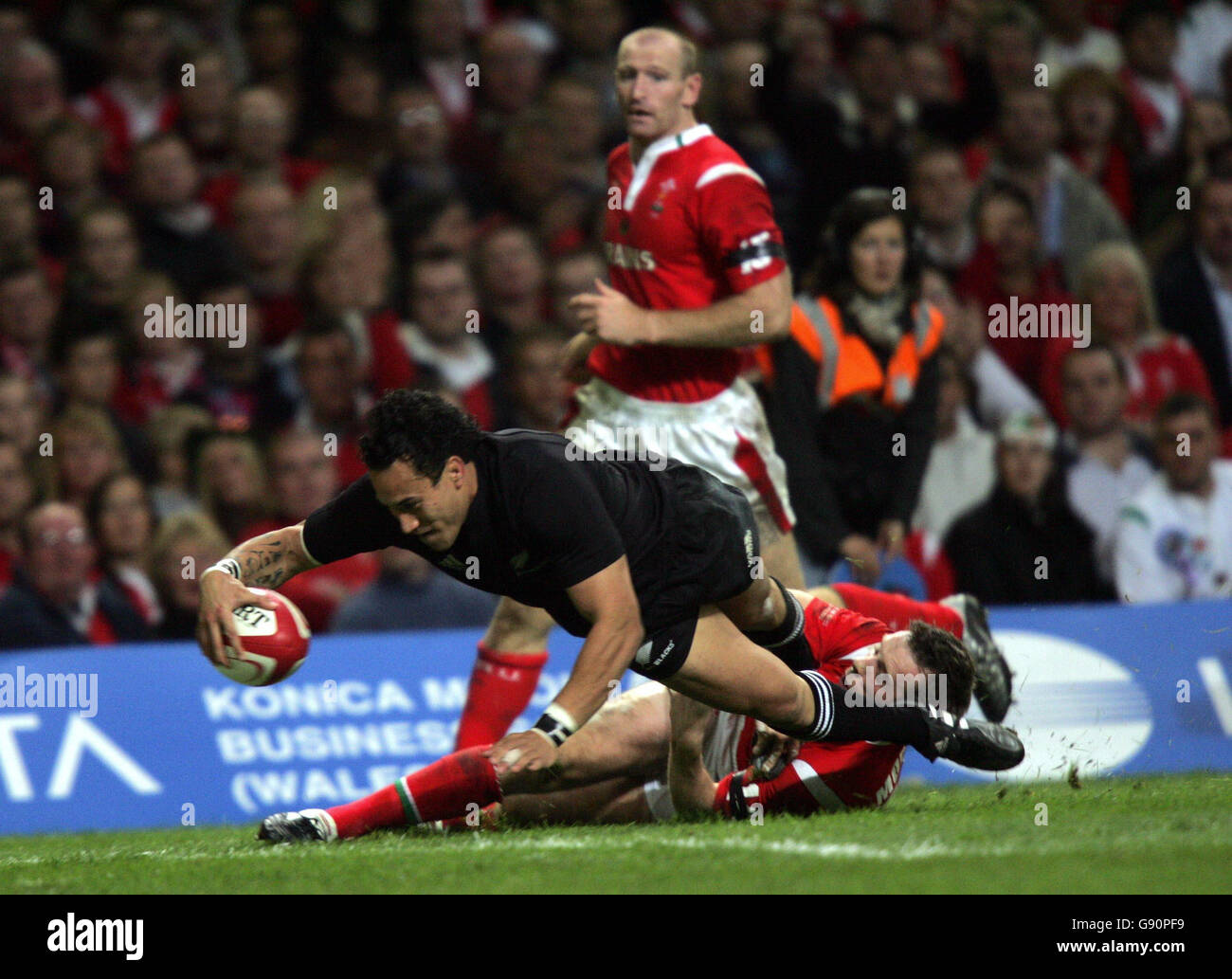 New Zealand's Rico Gear (L) scores a try during the international match ...
