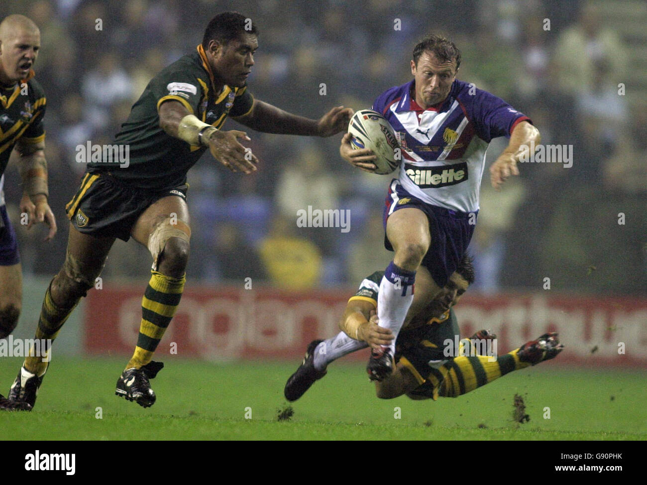 Great Britain's Michael Higham is tackled by Australia's Petero ...
