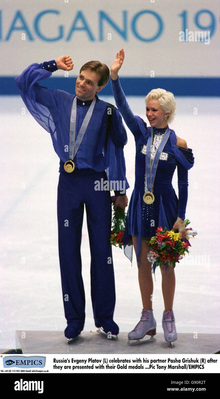 Russia's Evgeny Platov (L) celebrates with his partner Pasha Grishuk (R ...
