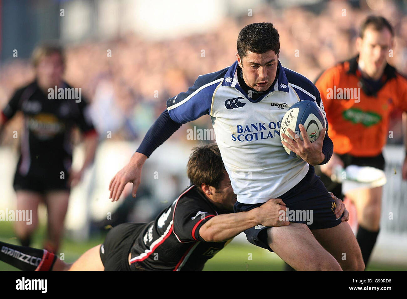 Leinster's Robert Kearney (R) is tackled by Edinburgh's Jamie Blackwood ...