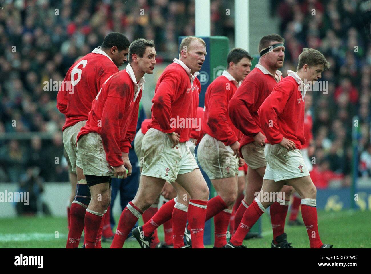 Welsh players look dejected after their heavy defeat to England Stock ...