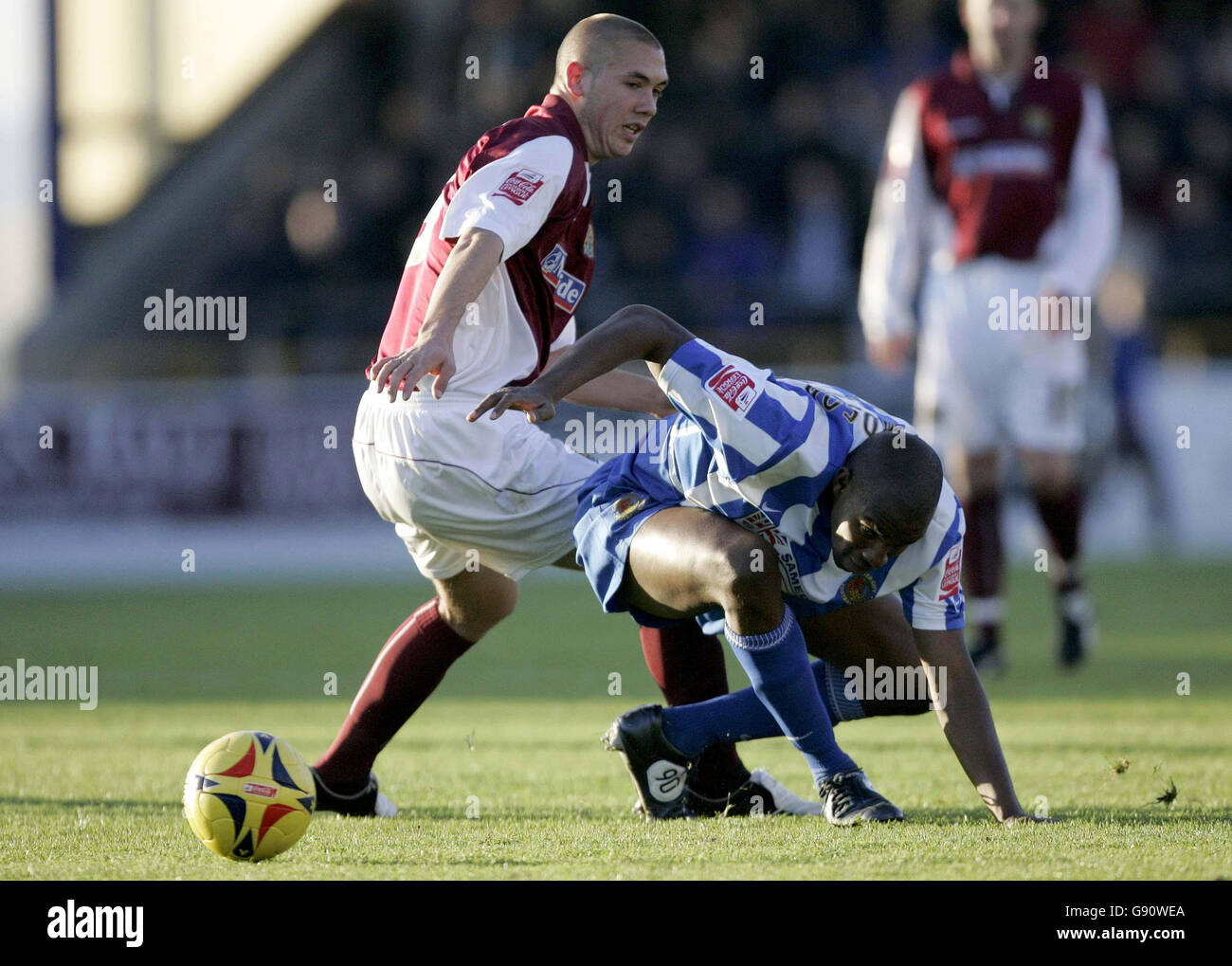 Chester City's Marcus Richardson (R) tangles with Northampton Town's ...