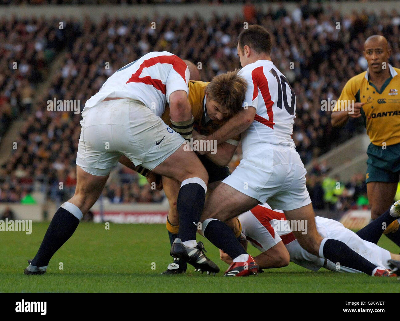 Australia's Drew Mitchell (C) scores a try past England's Phil Vickery ...