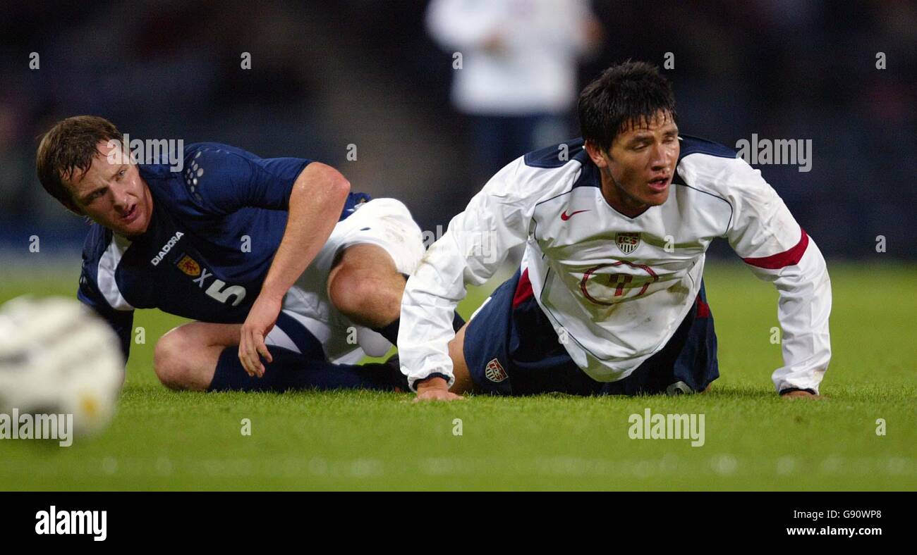 Scotland's goal scorer Andy Webster and USA's Brian Ching battle for ...