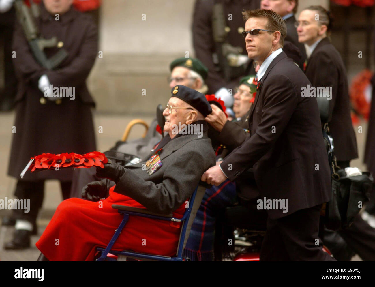 Veterans carry poppy wreaths during a Rememberance Sunday service ...