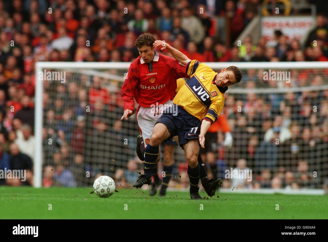 Ronny Johnsen, Manchester United (L) battles for the ball with Marc ...