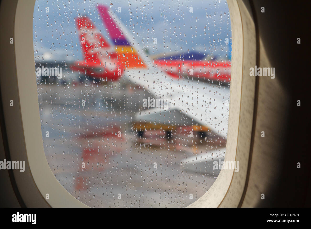 Rain drops view through airplane window Stock Photo - Alamy