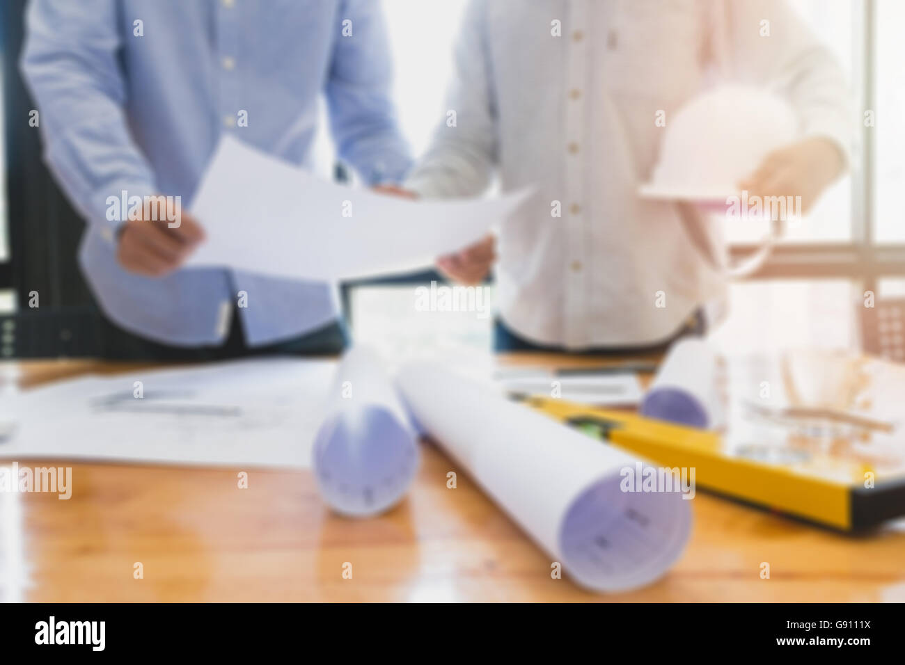 Architects concept,Blurred of Architects working with blueprints in the ...