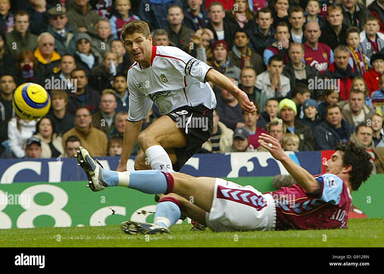 Liverpool's Steven Gerrard (L) battles for the ball with Aston Villa's ...