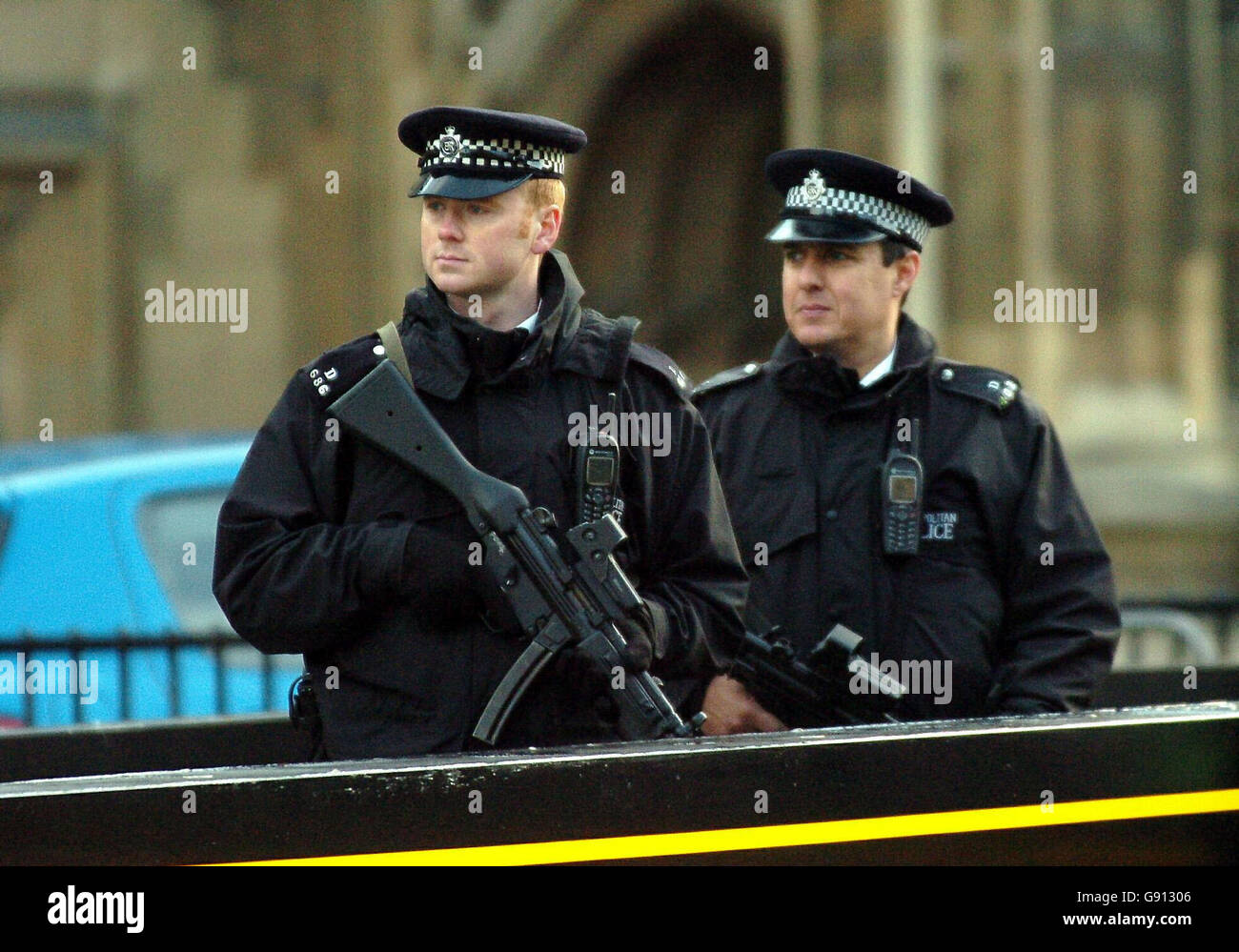 Armed police patrol outside the houses of parliament in london hi-res ...