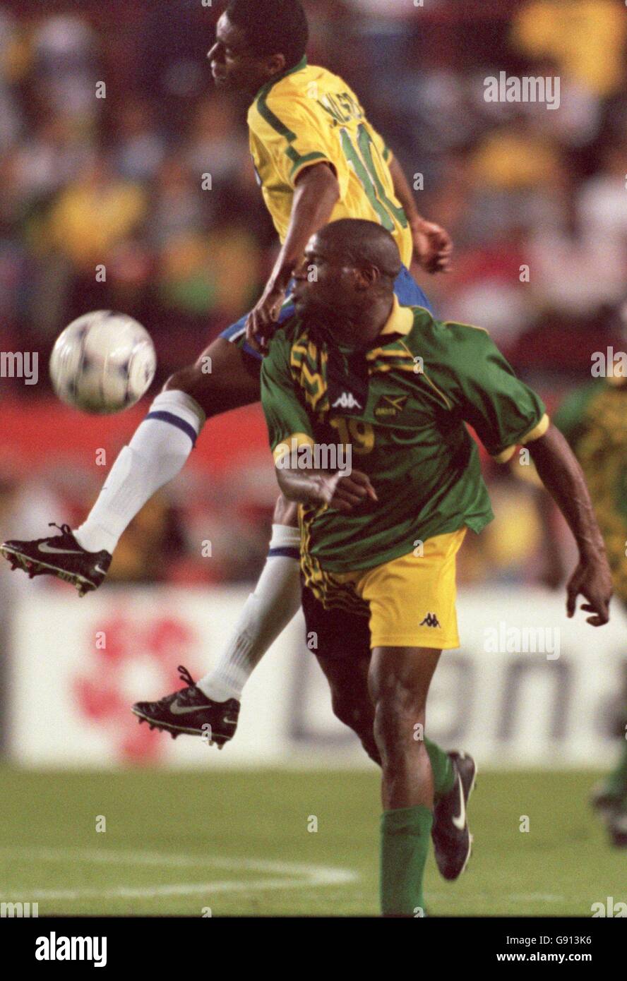 Denilson of Brazil (back) gets above Jamaica's Frank Sinclair (front ...