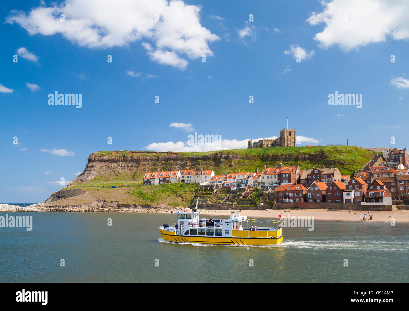 View over harbour entrance to St Mary`s church on East cliff. Whitby ...